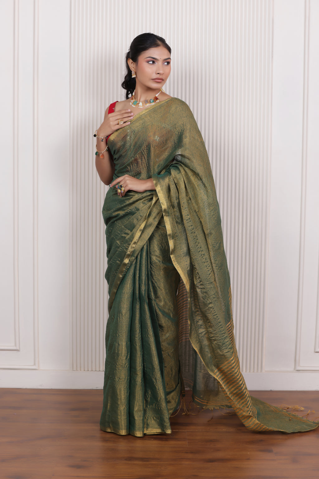 LUXE GREEN LINEN TISSUE SAREE WITH LUSTROUS ZARI STRIPES AND REFINED D ...